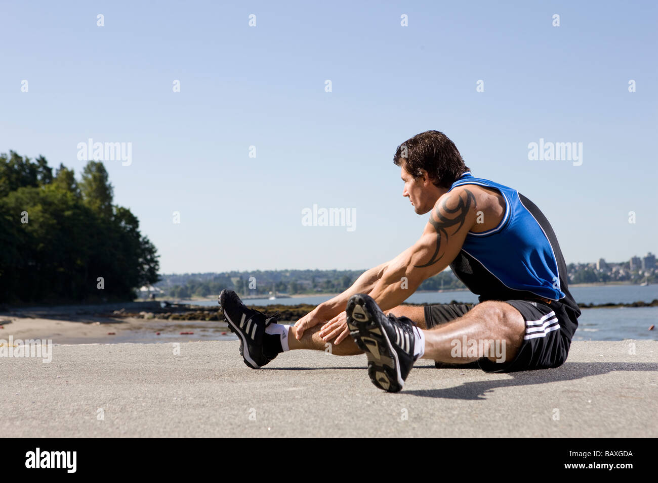 fit male stretching outdoors Stock Photo - Alamy