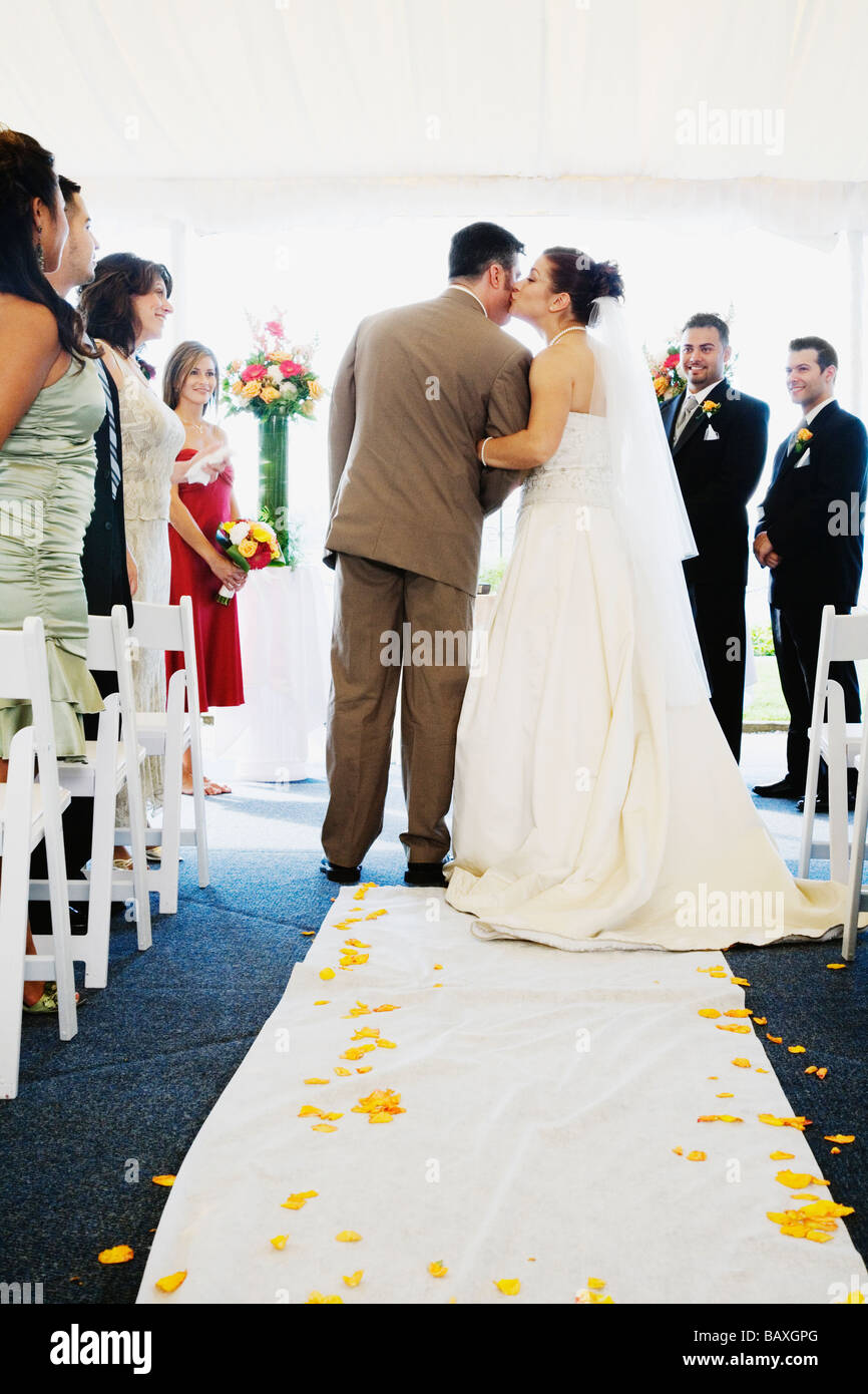 Bride kissing father in aisle Stock Photo - Alamy