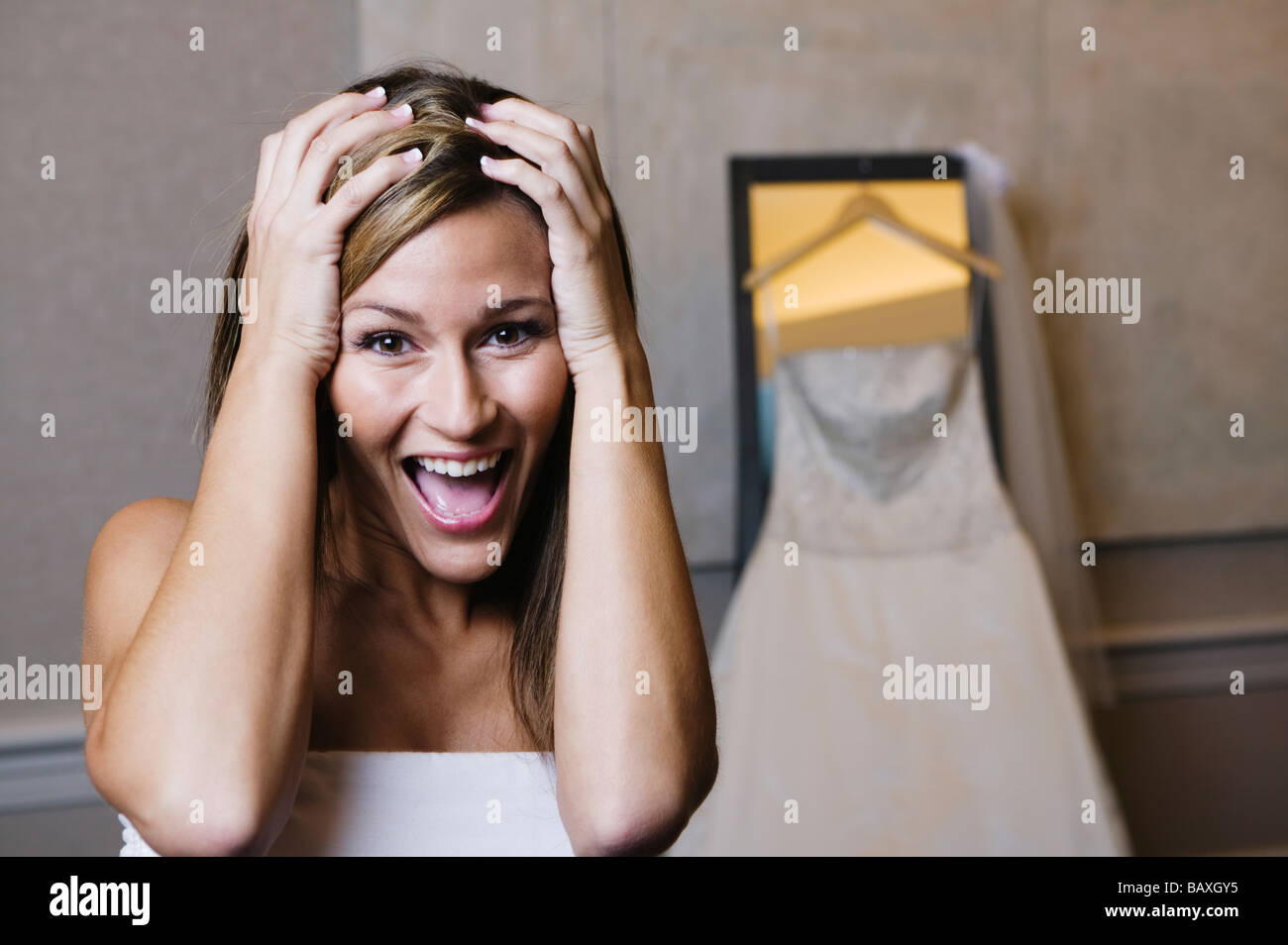 Bride yelling with hands on head Stock Photo - Alamy