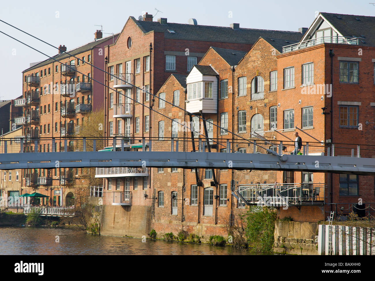 Man walking across Milennium Bridge, a new footbridge spanning the ...