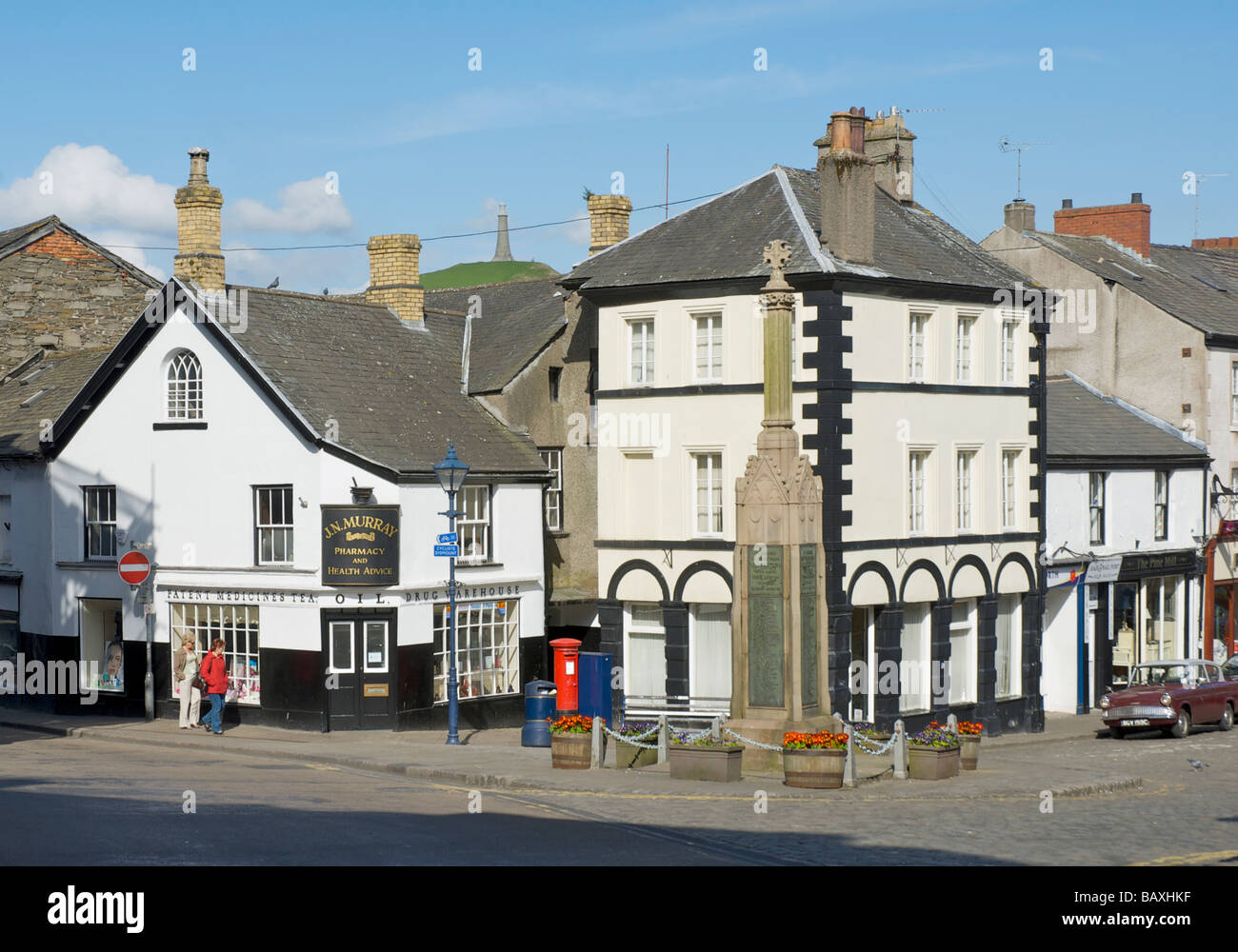 Two people window shopping in the Market Square, Ulverston, Cumbria ...