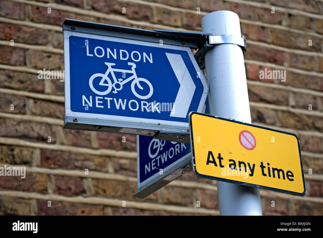 blue and white london network cycling signs and no waiting at any time ...