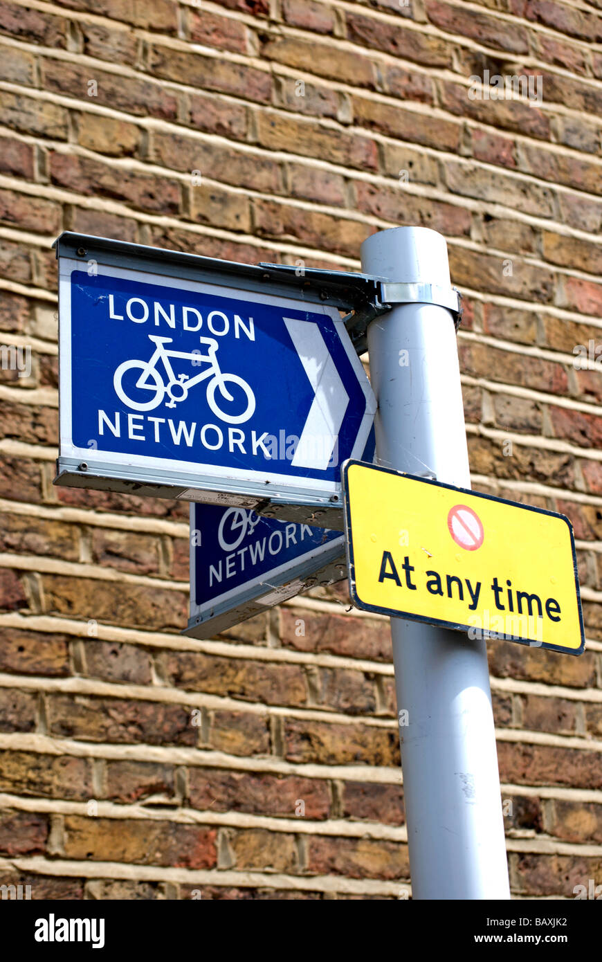 blue and white london network cycling signs and no waiting at any time ...