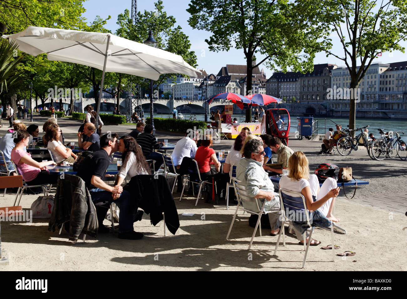 People at a cafe along the banks of the River Rhine, Riviera Klein ...