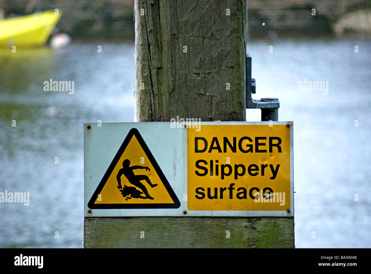 british danger slippery surface sign beside river Stock Photo - Alamy