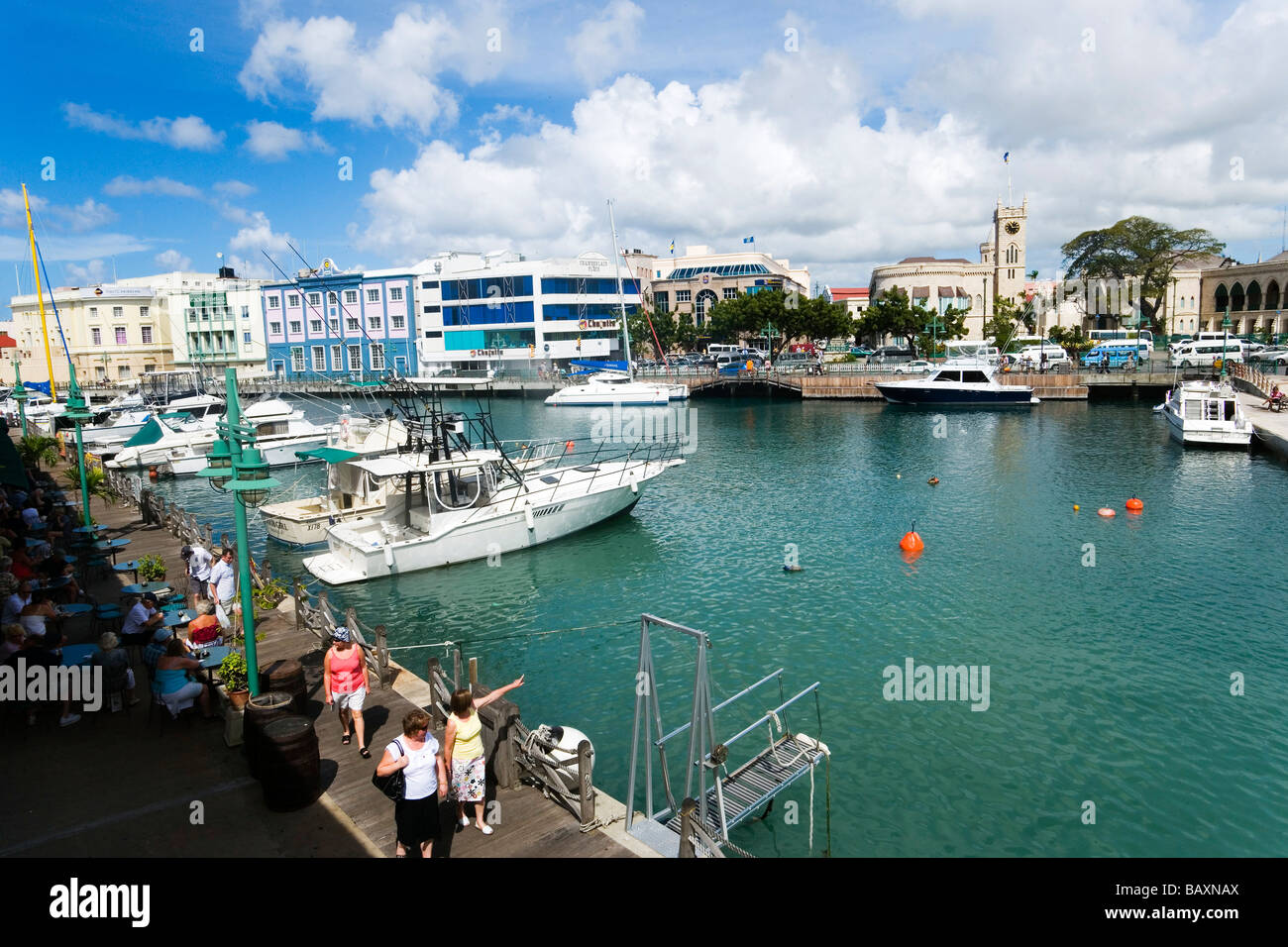 People sitting in a waterfront cafe, Bridgetown, Barbados, Caribbean ...