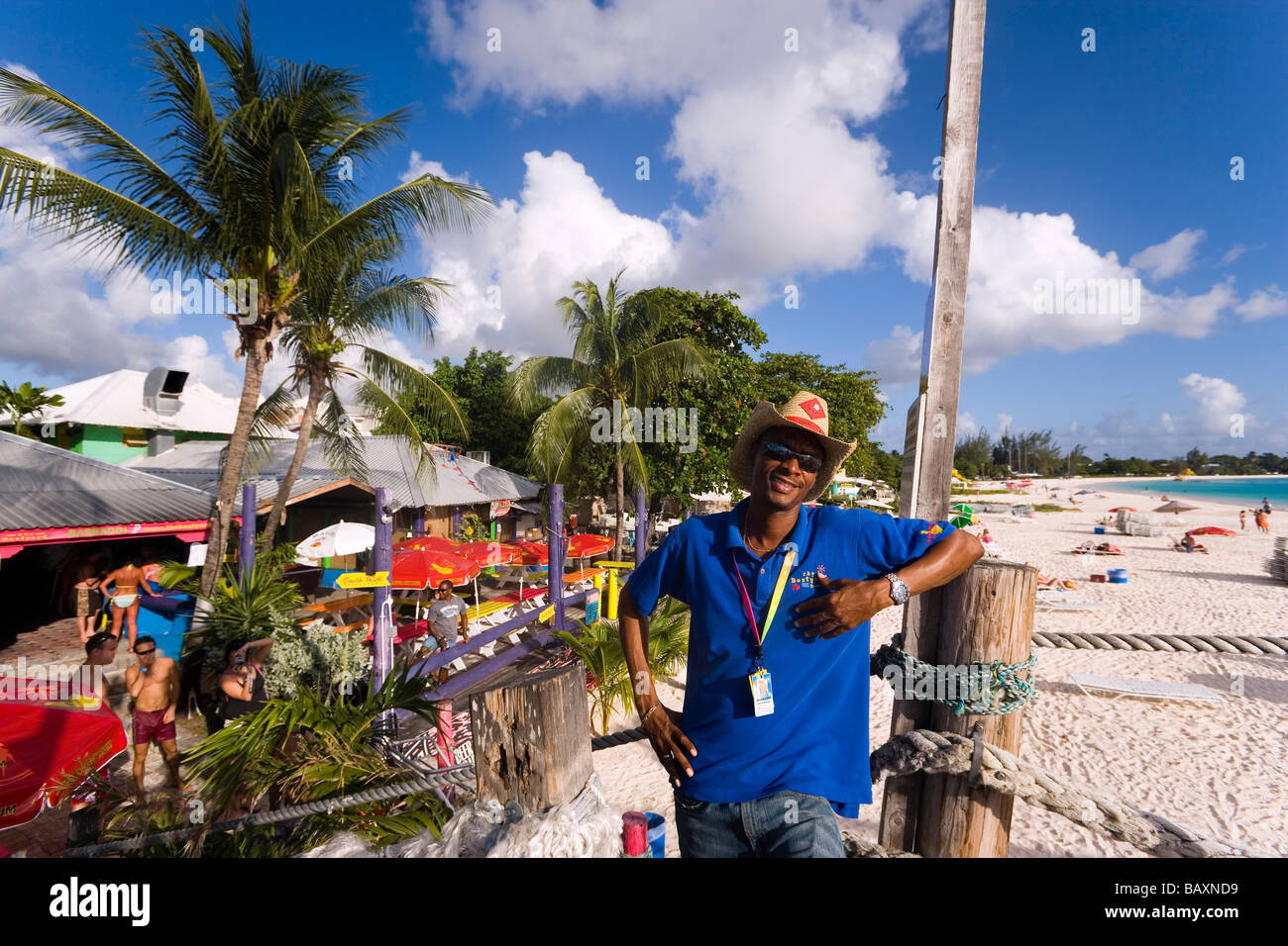 Man smiling at camera, the Boatyard beach bar in background Stock Photo ...