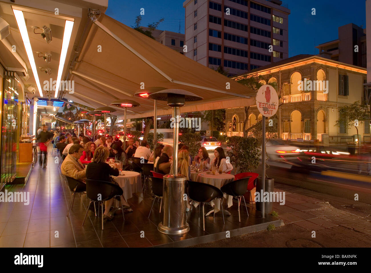 People sitting in an outdoor cafe in the evening, Archiepiskopou ...