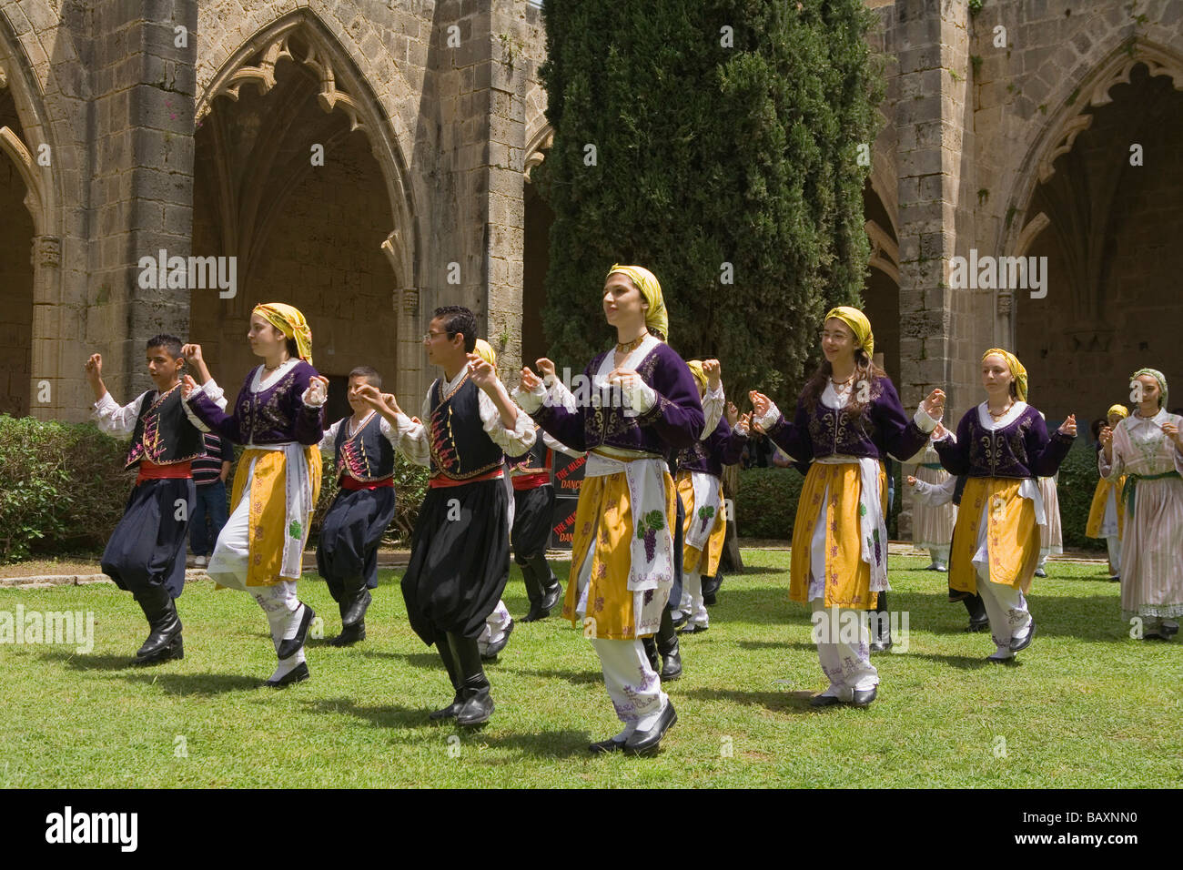 Local men and women in traditional costume dancing, folk dance ...