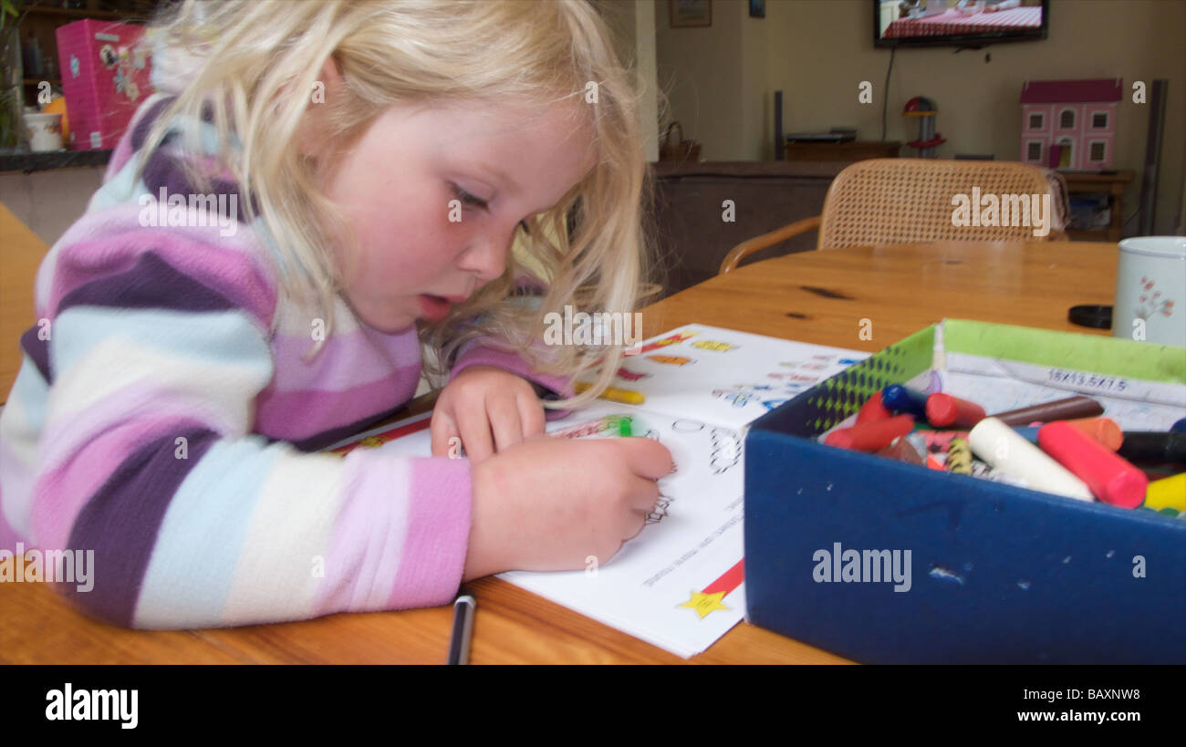 Girl drawing colouring doing homework hi-res stock photography and ...