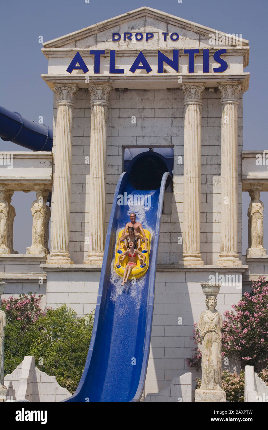 Three young people on a water slide, WaterWorld Waterpark, Agia Napa ...