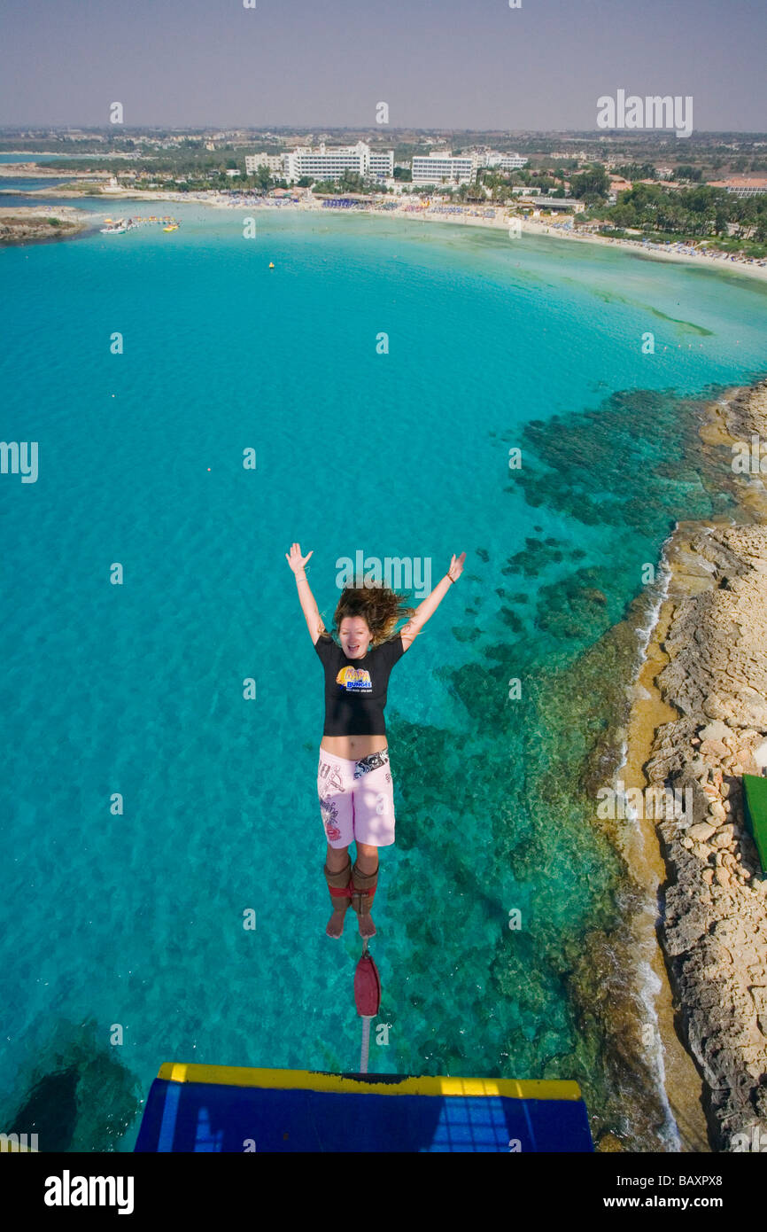 A young woman bungee jumping near Nissi Beach, Napa Bungee, Agia Napa ...
