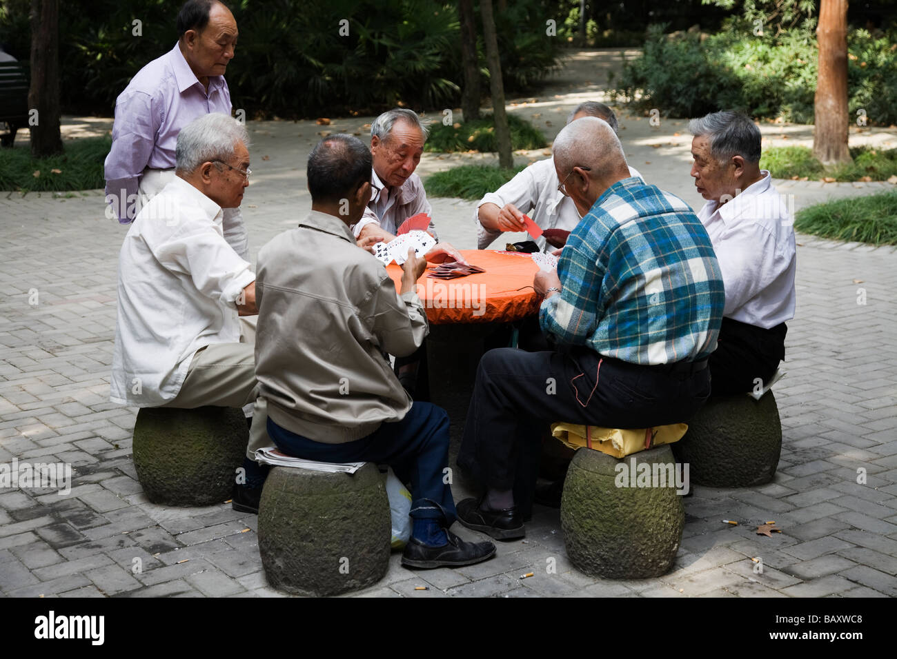 Men Playing Cards Around Table High Resolution Stock Photography and ...