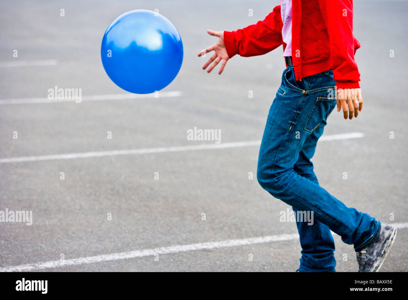 Asian man bouncing ball Stock Photo - Alamy