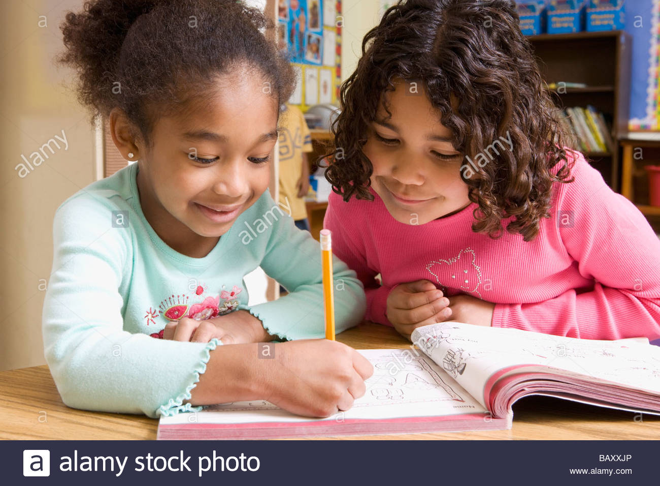 Classmate Helping Friend Stock Photos & Classmate Helping Friend Stock ...
