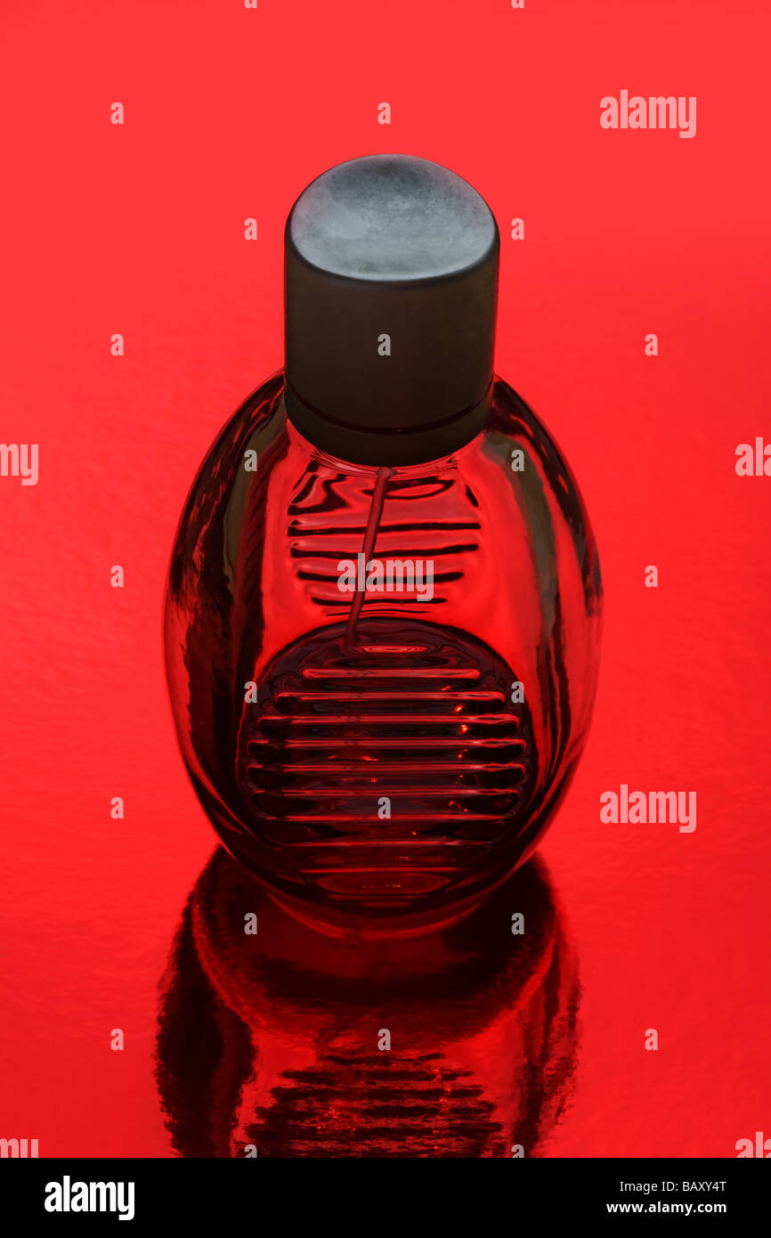 red perfume bottle Stock Photo - Alamy