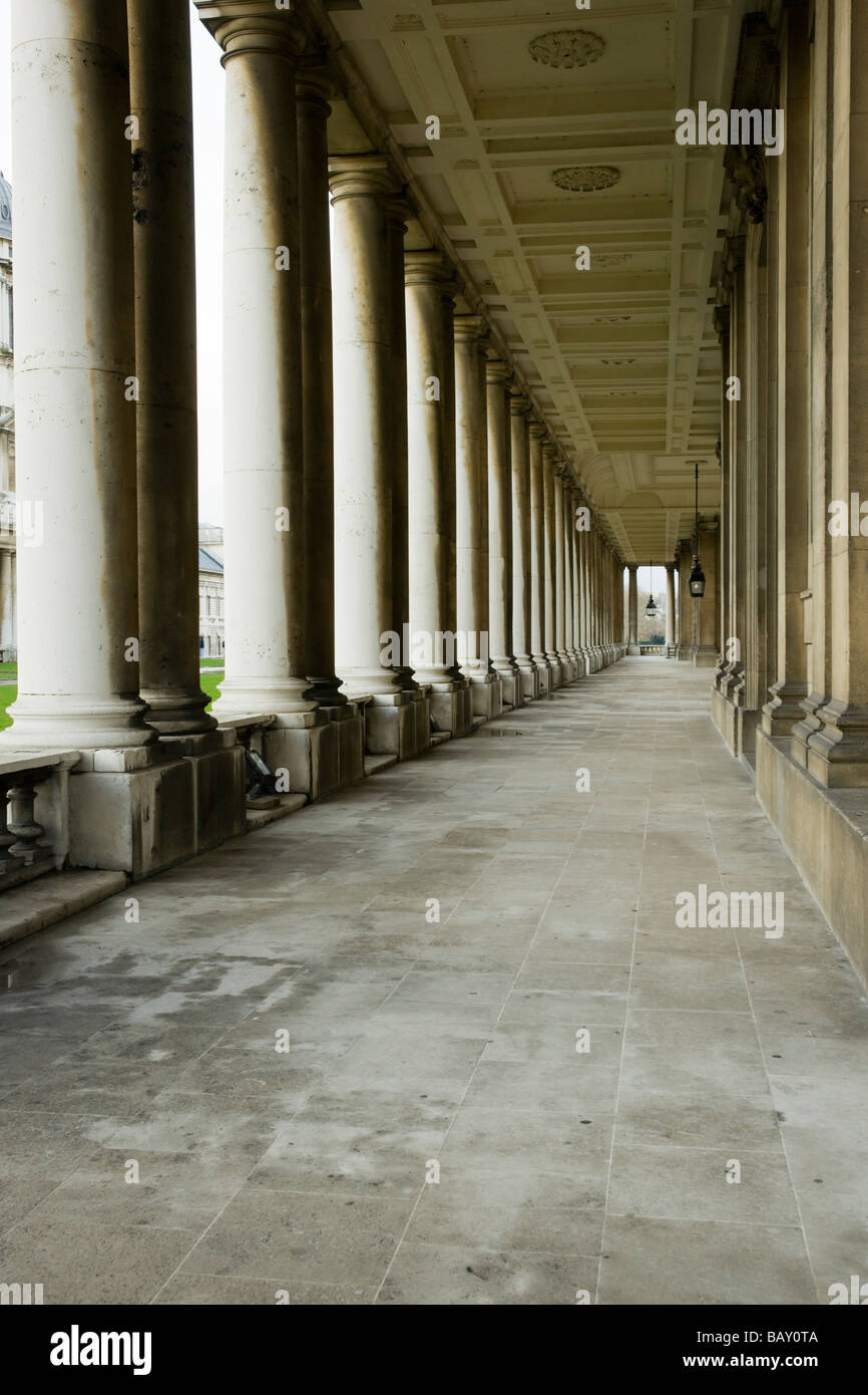 Classical stone colonnade of a palace leading into distance Stock Photo ...
