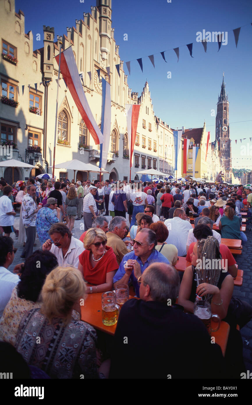 Festive crowd celebrating the Old Town feast surrounded by Gothic city ...