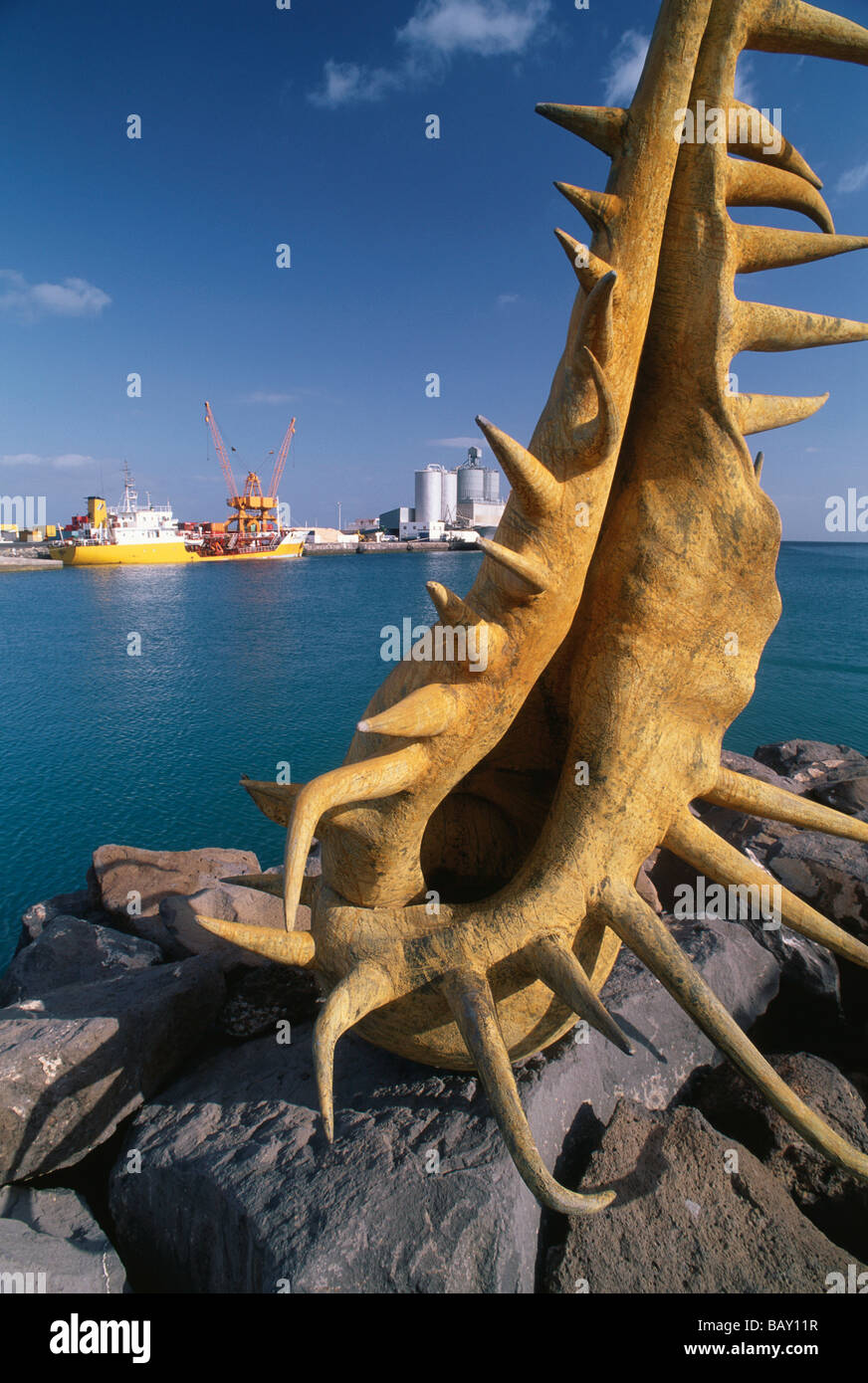 Sculpture shaped like a gigantic shell at harbour of Puerto del Rosario ...