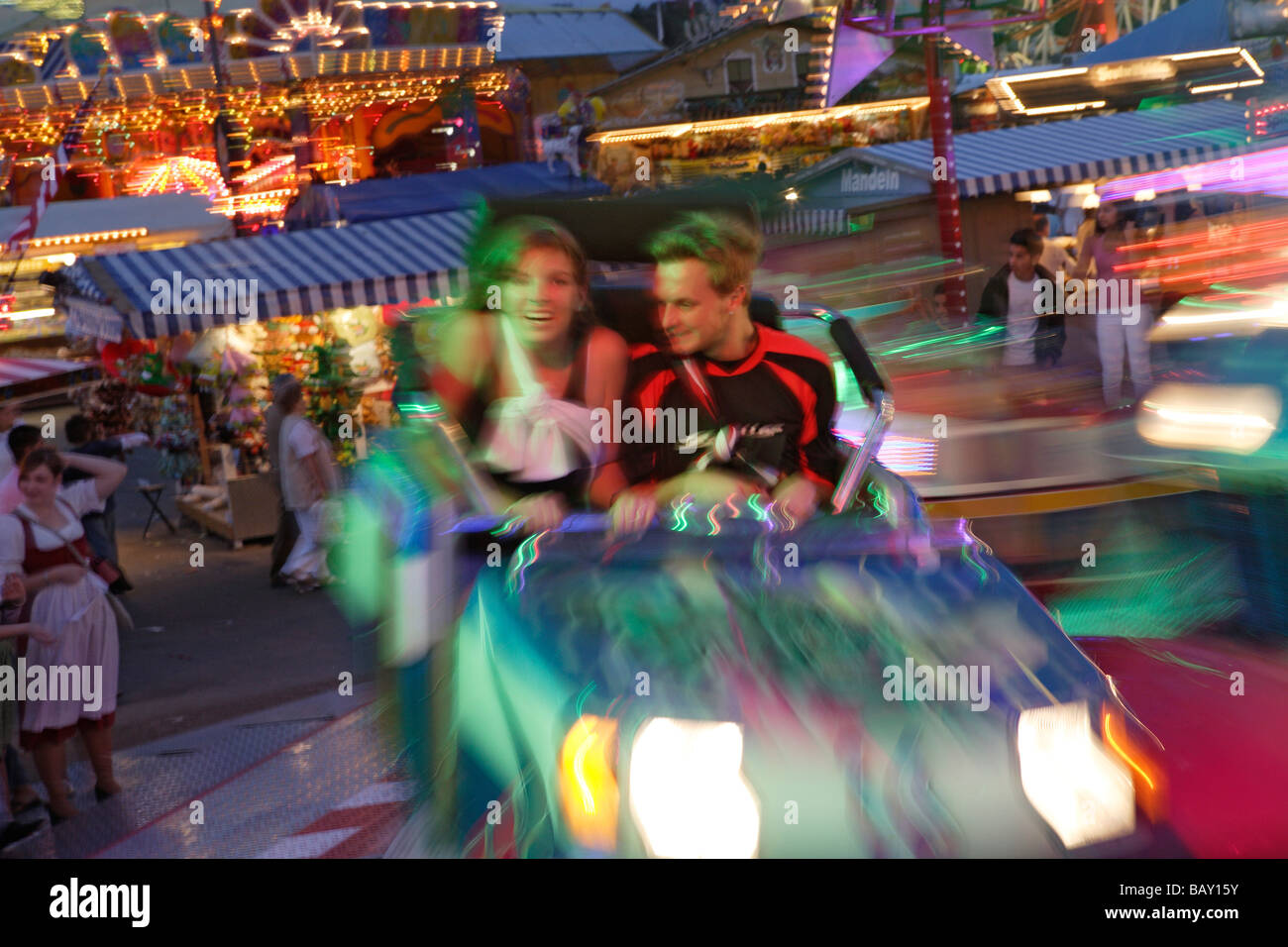 People at Carnival ride in the evening, Oktoberfest, Munich, Bavaria ...