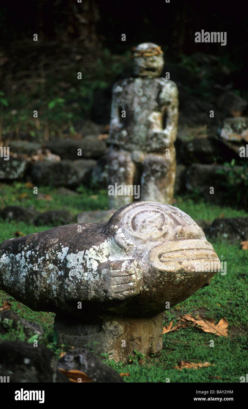 Weather beaten stone statues at an archaeological site in the village ...