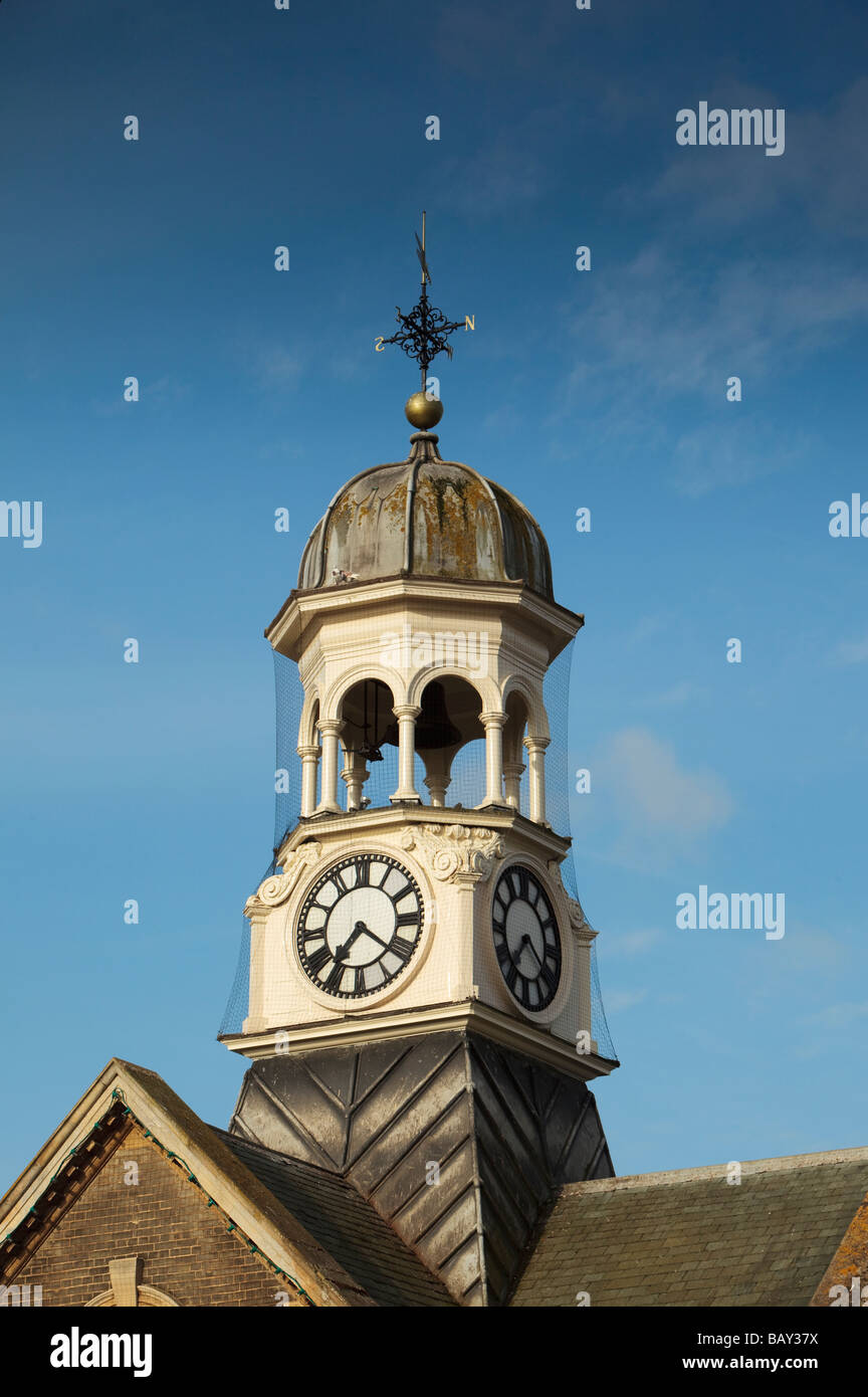 Thetford Guildhall bell clock tower with weather vane and blue sky ...