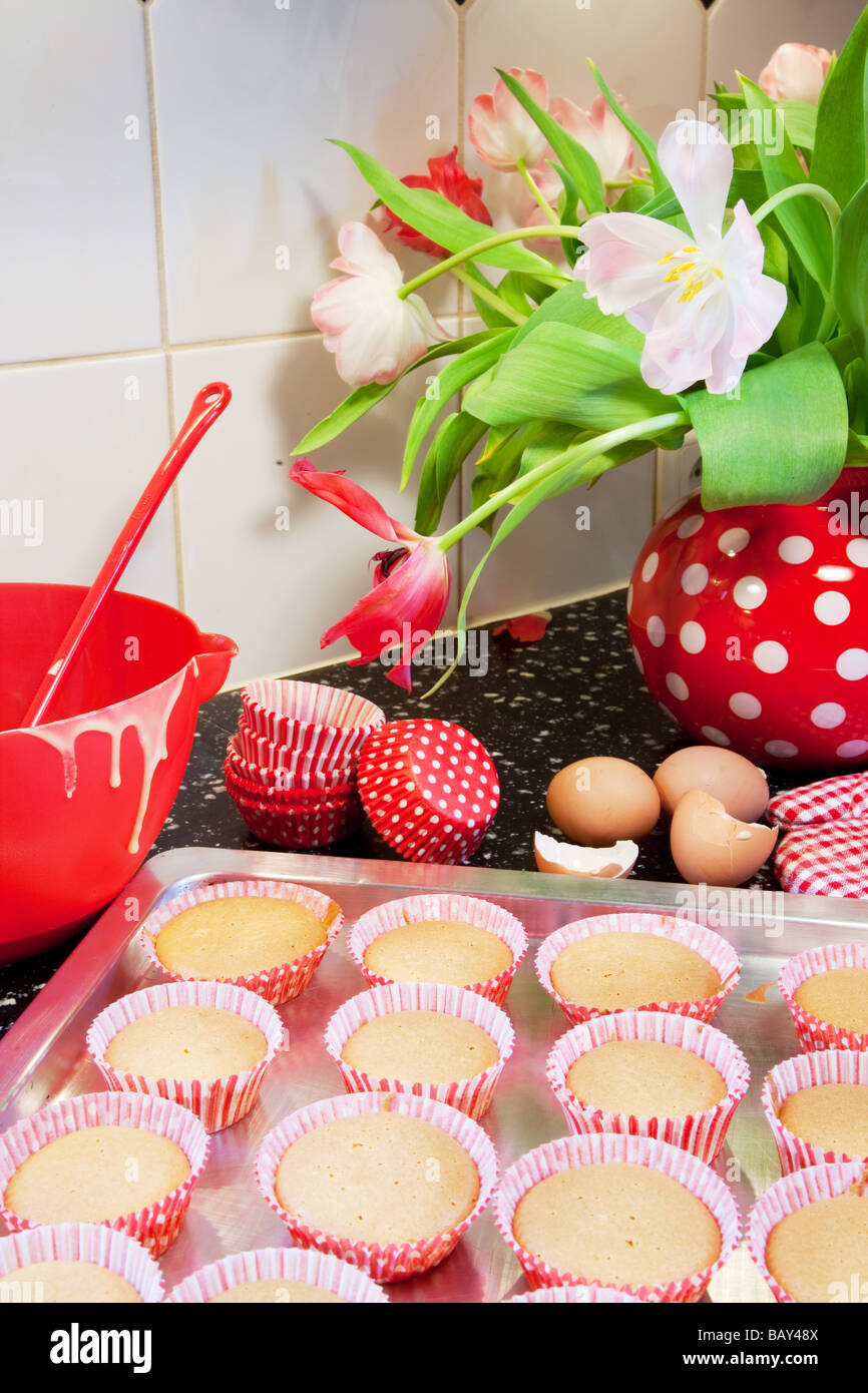 Baking fancy cakes in domestic kitchen in red Stock Photo - Alamy