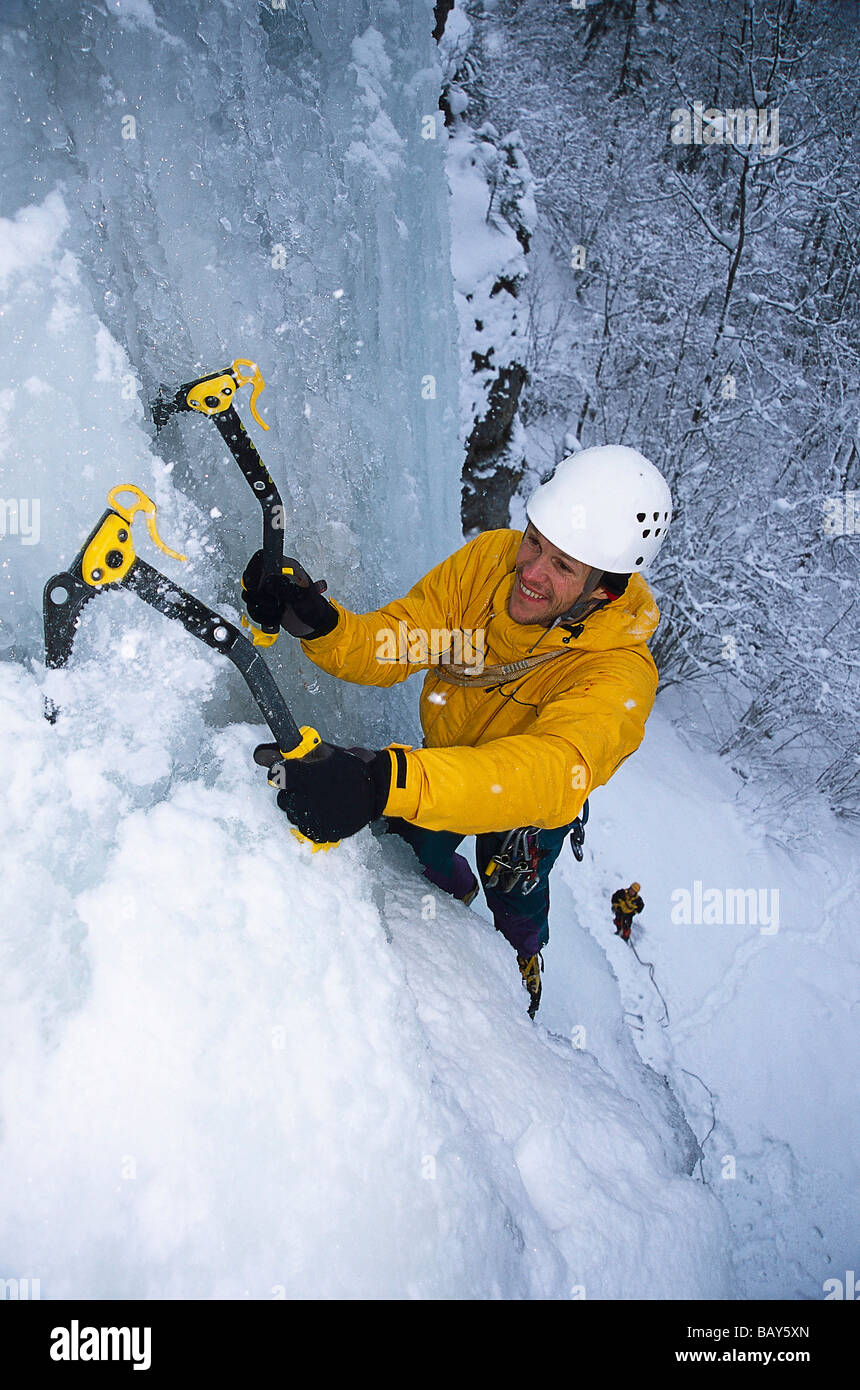 Man climbing ice fall hi-res stock photography and images - Alamy