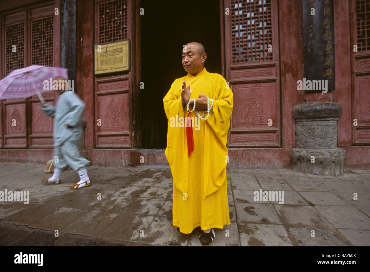 Shaolin monk leaving the temple after prayer, Shaolin Monastery, known ...