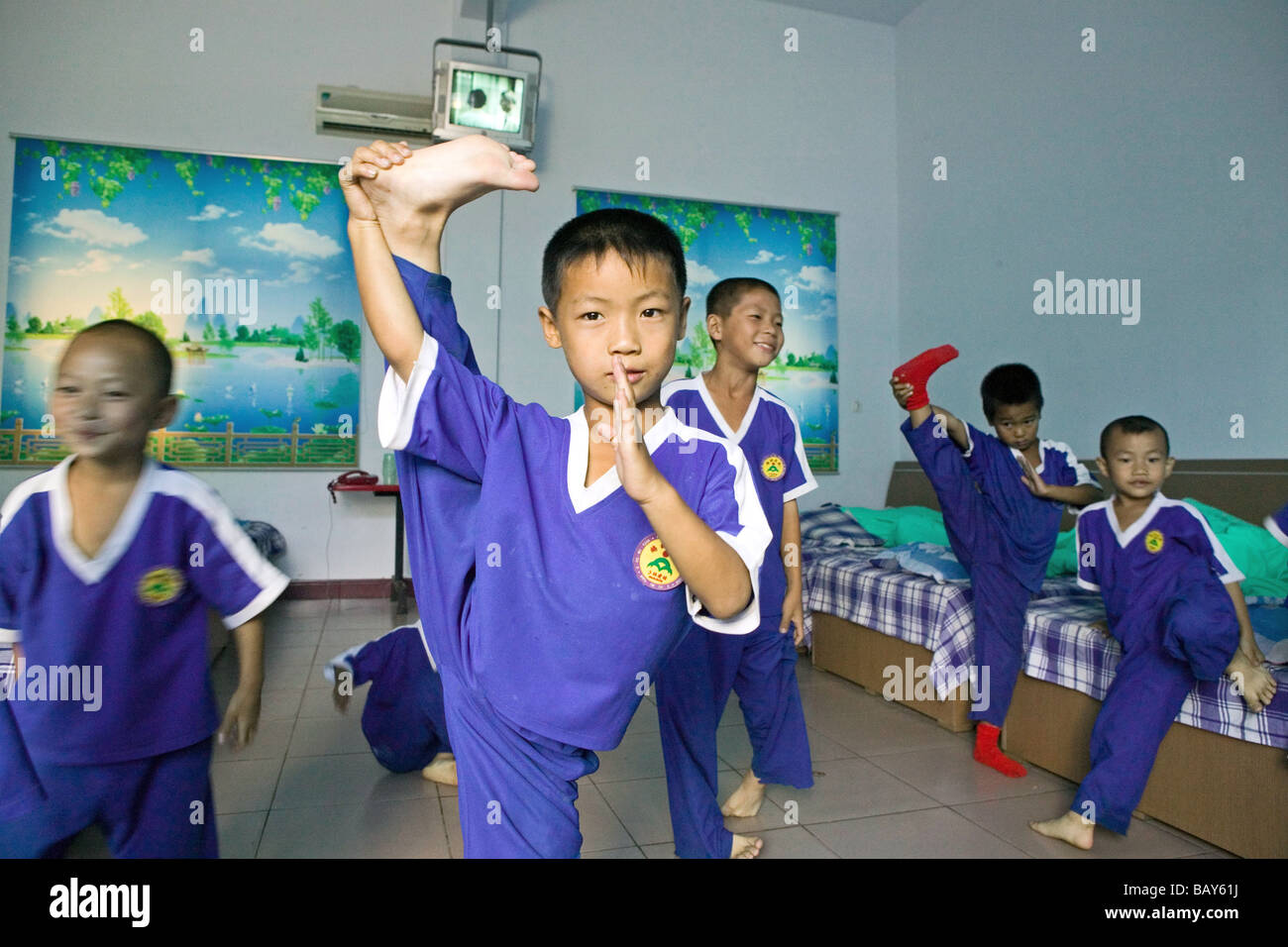 Very young pupils in the dormitory, Kung Fu training at kindergarten ...