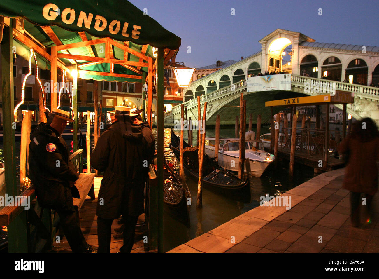 Tree Gondola drivers in front of a gondola renting service, Rialto ...
