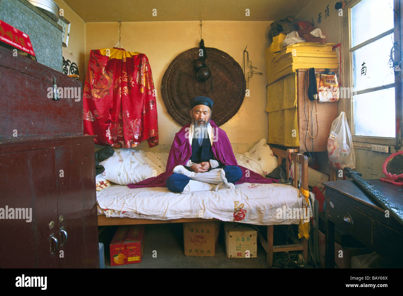 Monk meditating in lotus position, Mount Wudang, Wudang Shan, Taoist ...