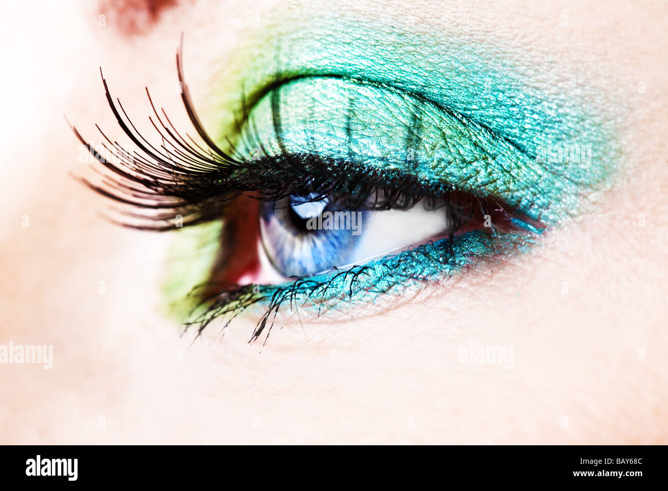Detail of a blue eye with green eyeshade and long lashes Stock Photo - Alamy