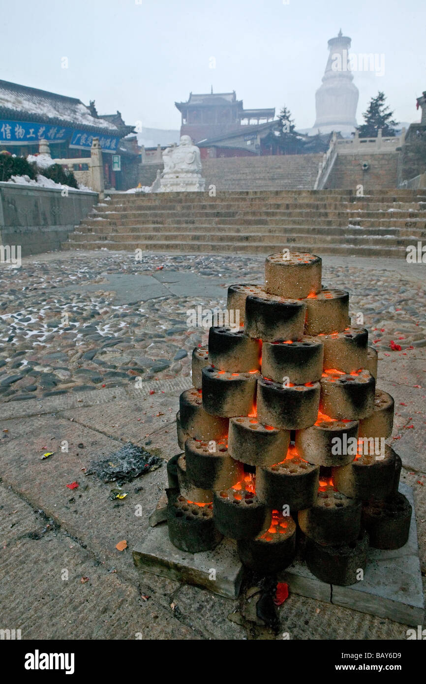 Fire with coal for the Chinese New Year festival, Great White Pagoda ...