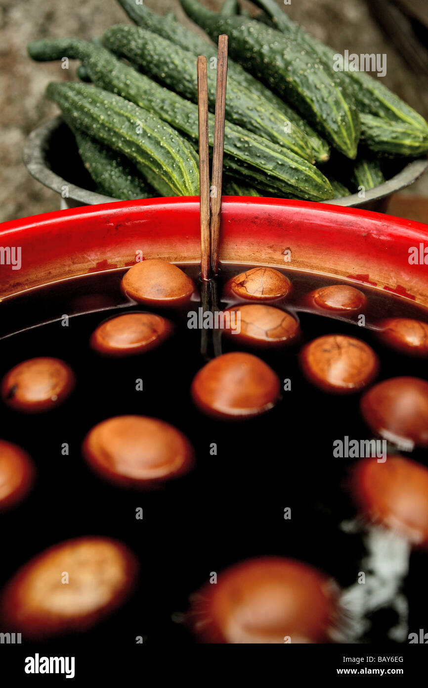 Cucumbers and hard boiled eggs cooked in black tea, soy sauce and ...