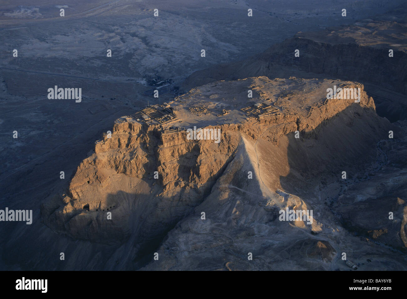 Aerial view of Masada, ancient palaces and fortifications on the top of ...