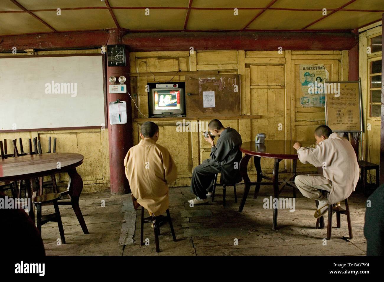 Monks eating at the canteen in front of the television, Xixiang Chi ...