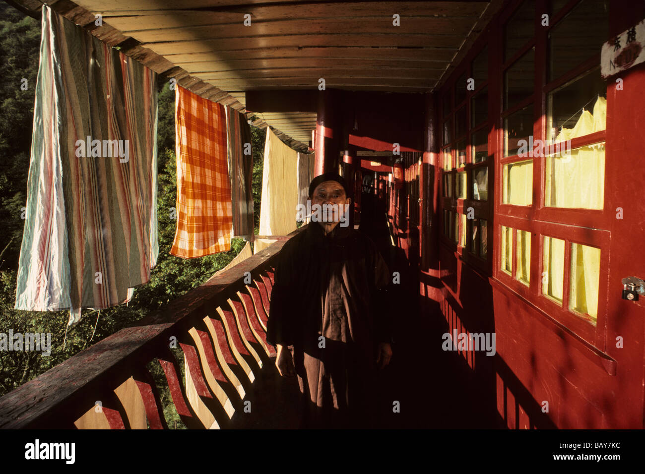 A monk drying laundry, Qingyin monastery, Emei Shan, Sichuan province ...