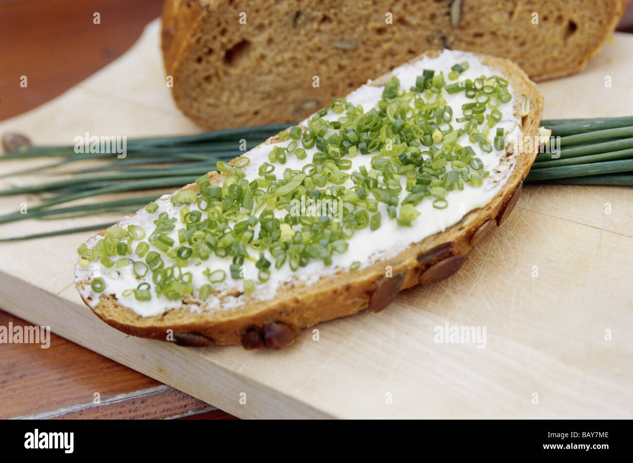 Slice of bread with chives Stock Photo - Alamy