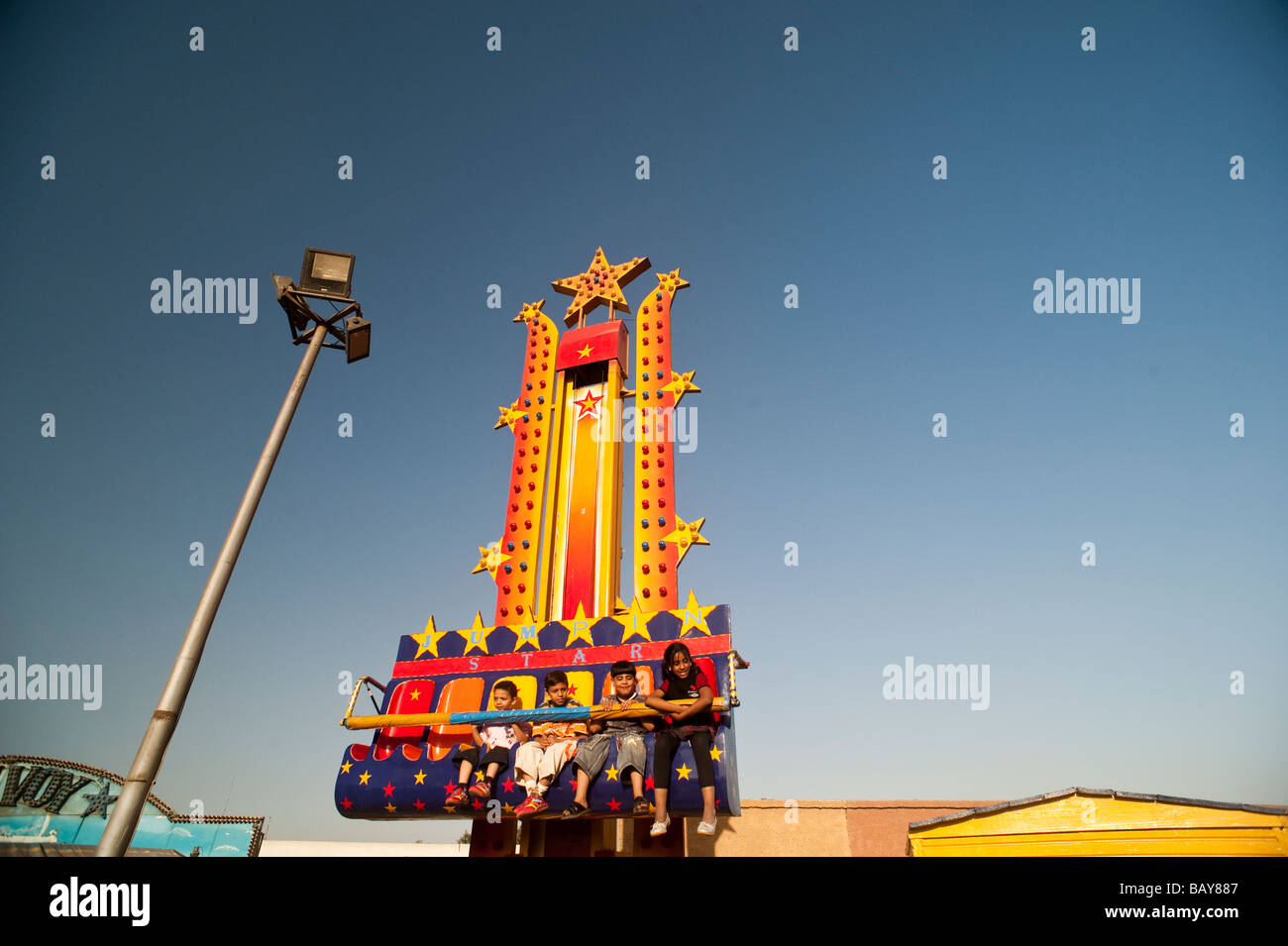 Children at a Cairo amusement park enjoy rides on Coptic Easter Stock ...