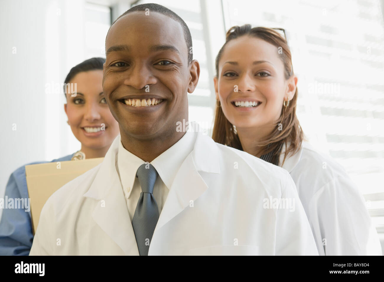 Multi-ethnic doctors and nurse posing Stock Photo - Alamy