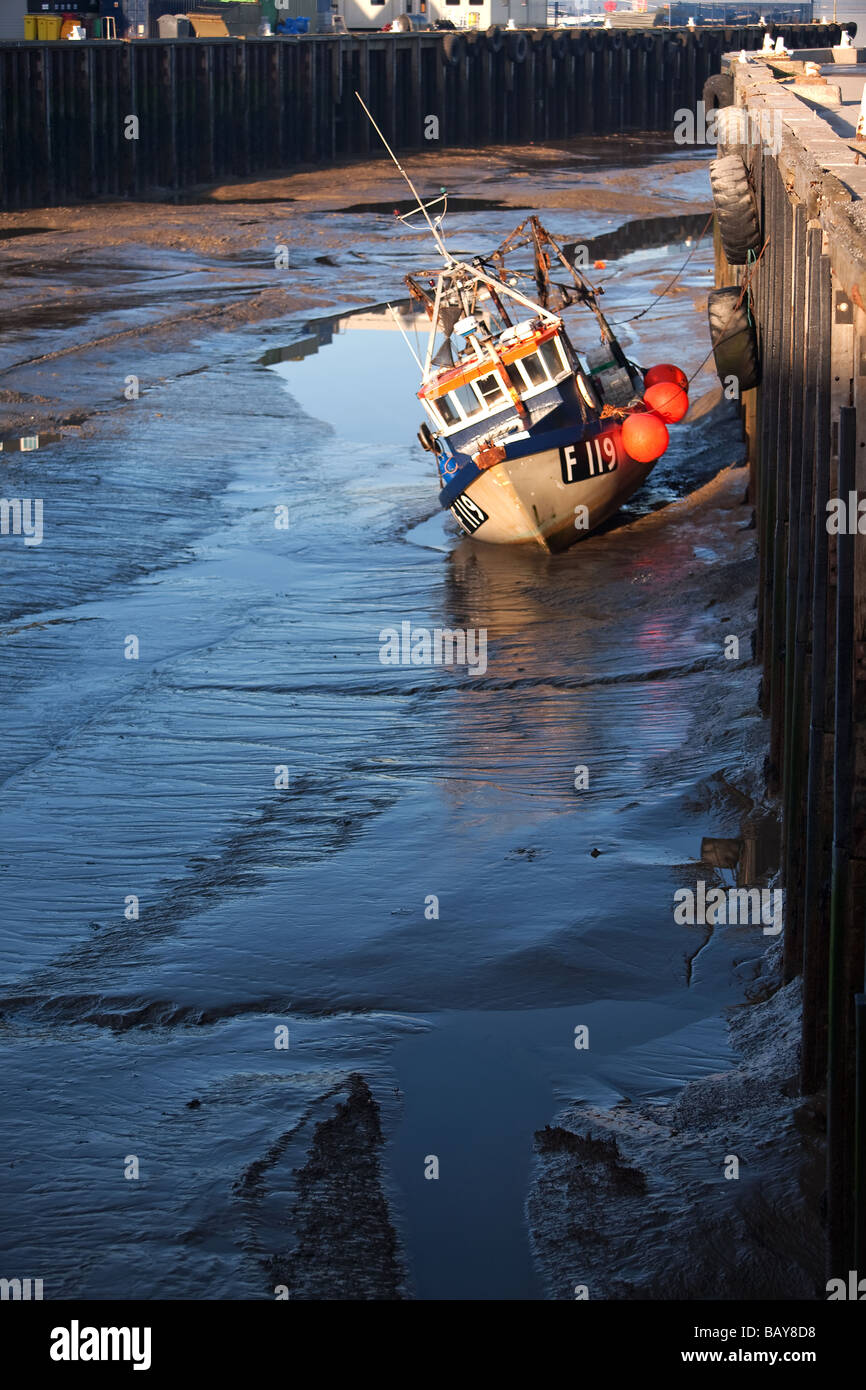 Low Tide fishing boat Stock Photo - Alamy