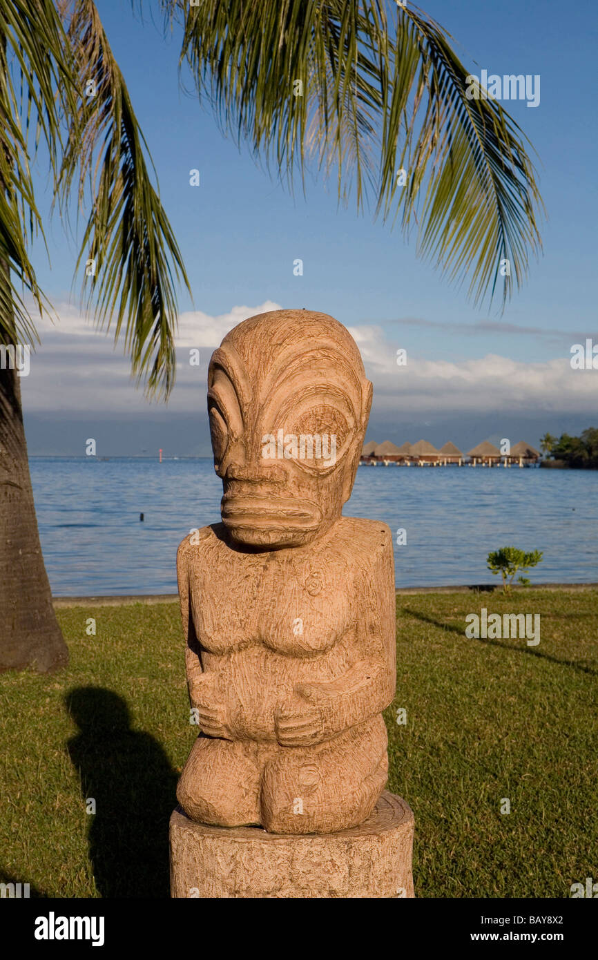 Tiki statue in front of lagoon in the evening light, Papeete, Tahiti ...