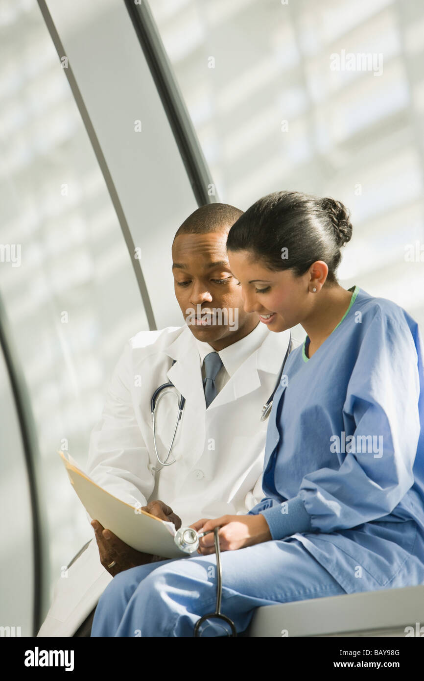 Doctor and nurse reviewing medical chart Stock Photo - Alamy Doctor and nurse reviewing medical chart Stock Photo - Alamy