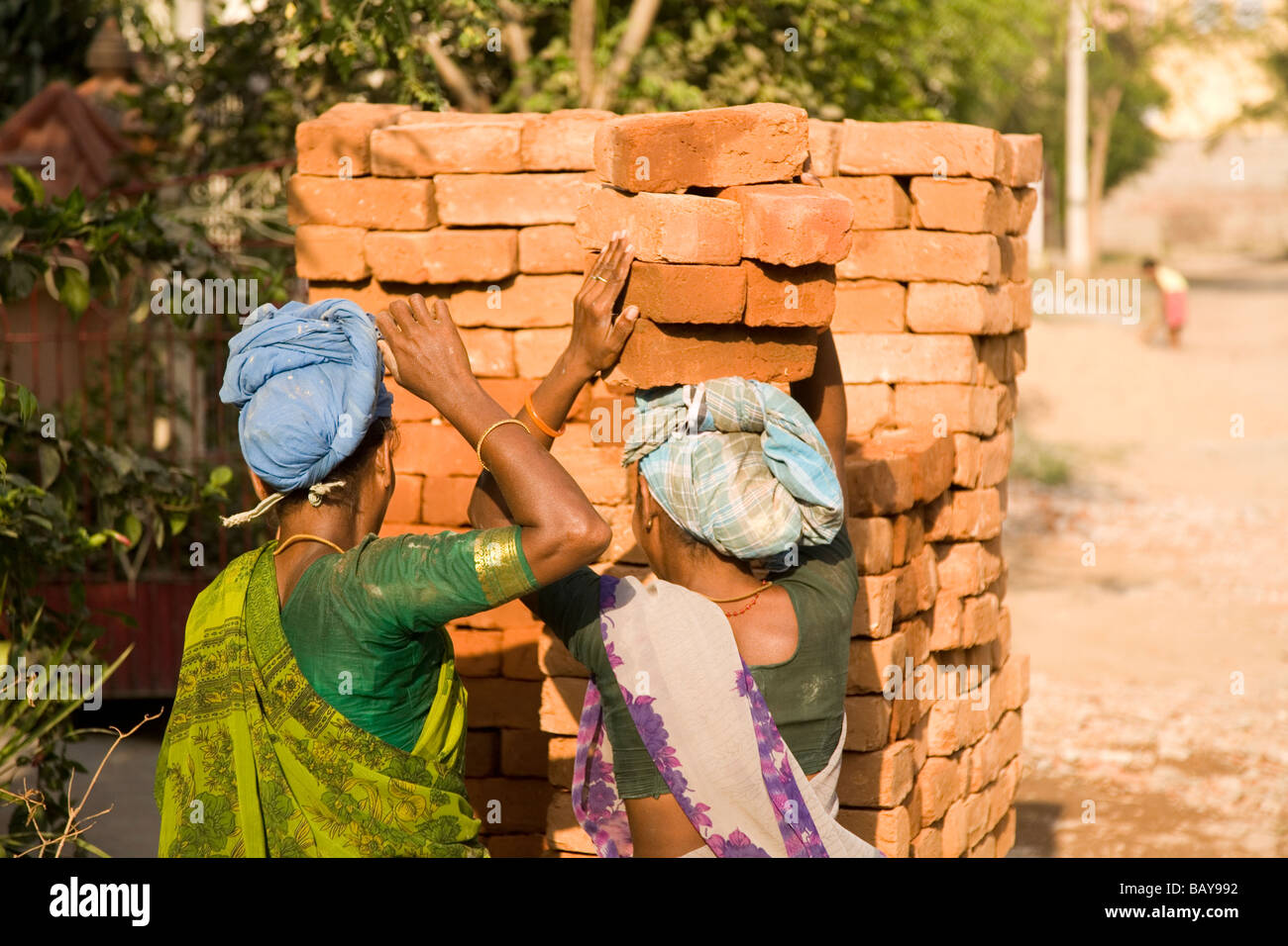 Women carrying bricks hi-res stock photography and images - Alamy