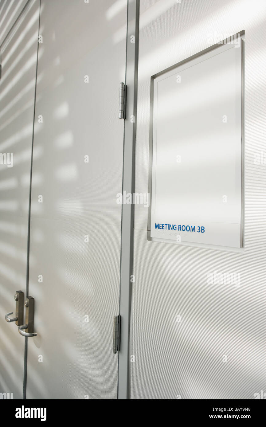 Meeting room sign next to door Stock Photo - Alamy
