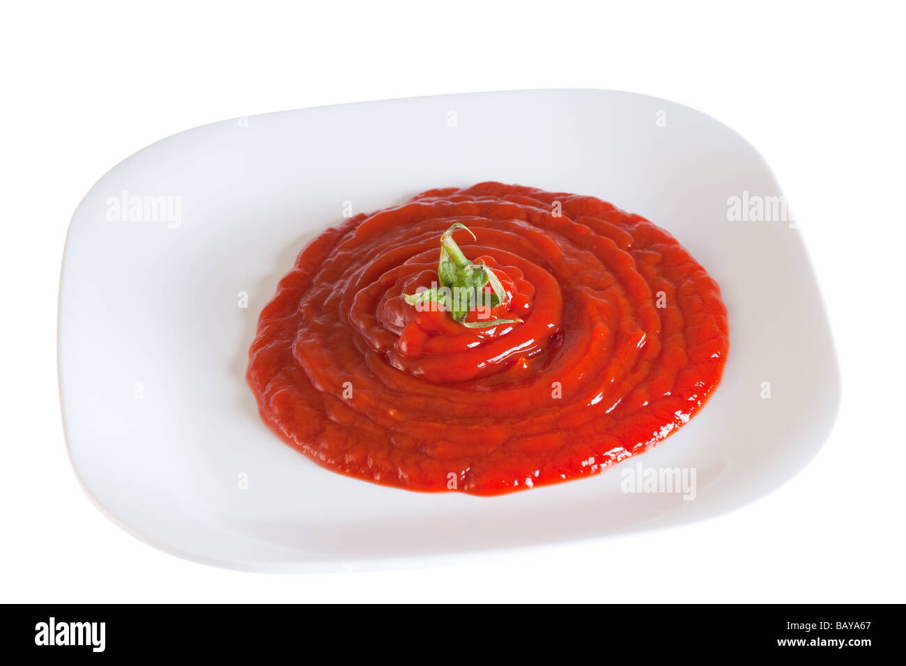 Tomato being smashed into ketchup Stock Photo - Alamy