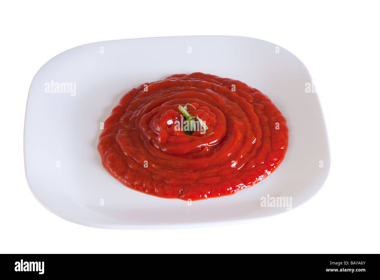 Tomato being smashed into ketchup Stock Photo - Alamy