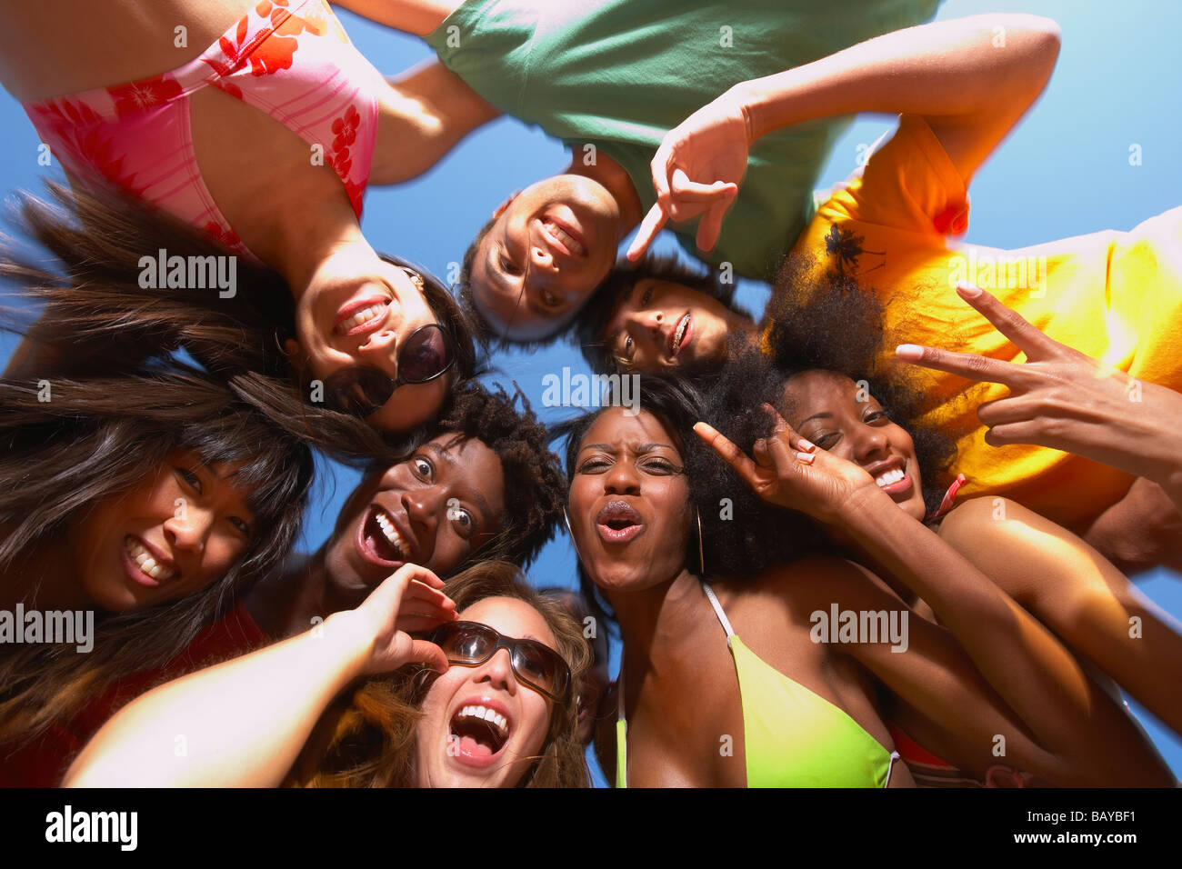 Multi-ethnic group of friends hugging Stock Photo - Alamy