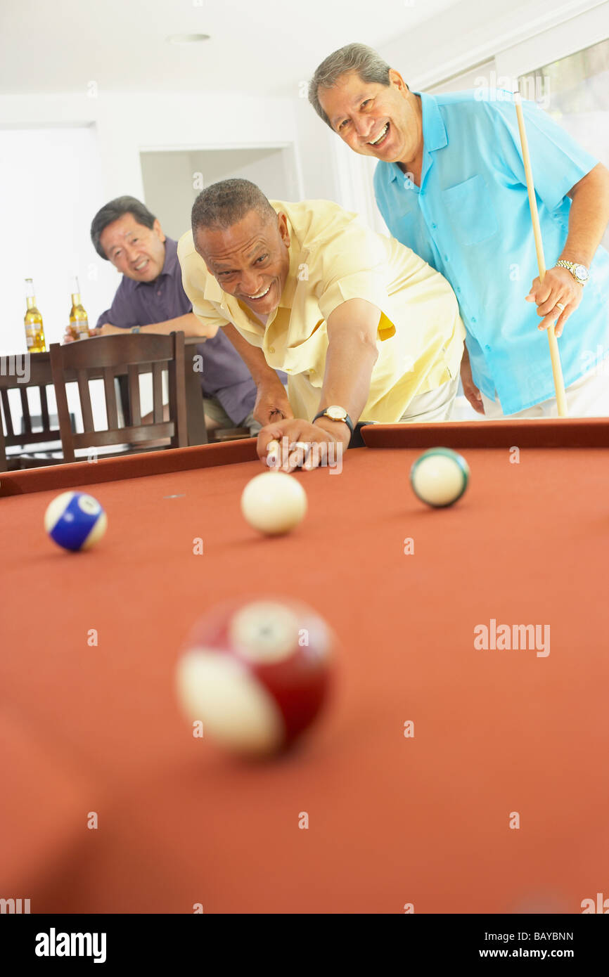Multi-ethnic group of friends playing pool Stock Photo - Alamy